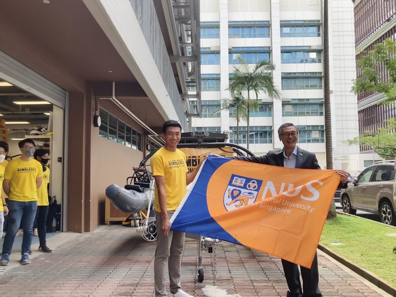 Presenting of NUS Flag to NUS Bumblebee Team – NUS Advanced Robotics Centre